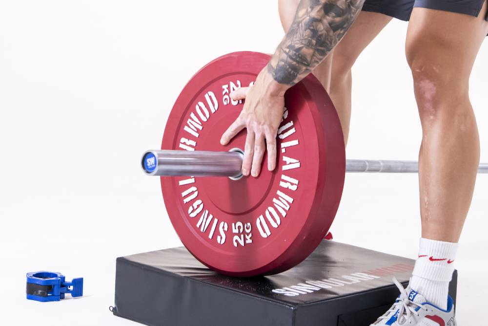 Tipos de discos olímpicos: cuál elegir para tu entrenamiento de fuerza